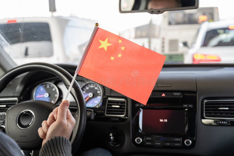 Middle Aged Man with Chinese Flag Driving a Car. China. Stock Image ...
