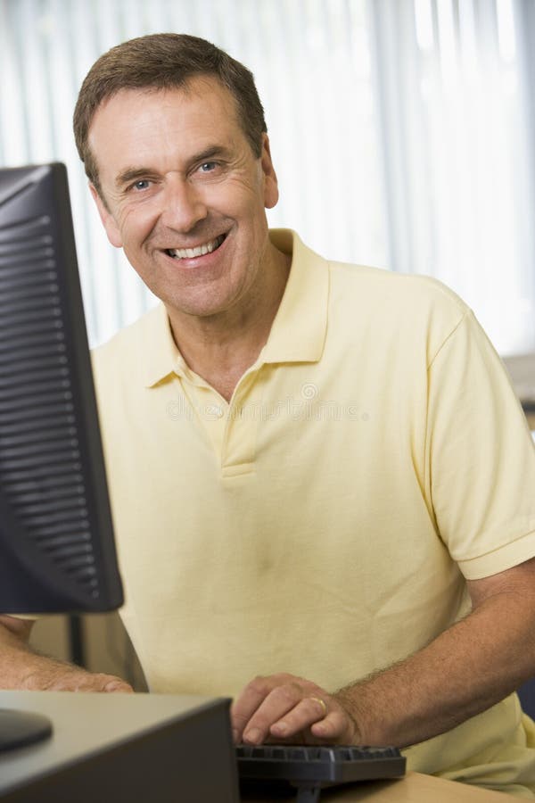 Middle Aged Man on a Computer Stock Image - Image of aged, class: 6080523