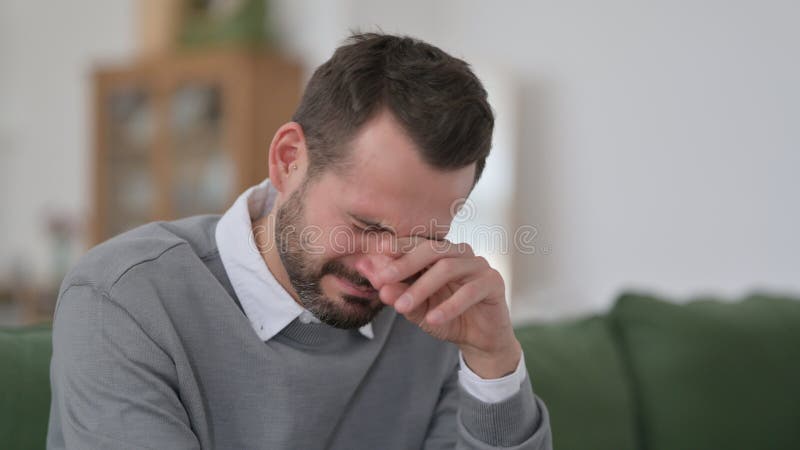 Middle Aged Man Crying while Sitting on Sofa Stock Image - Image of ...