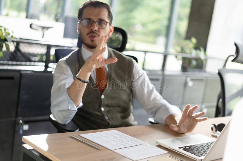 Middle-aged Man at a Desk Talking in an Office with Colleague, Smiling ...