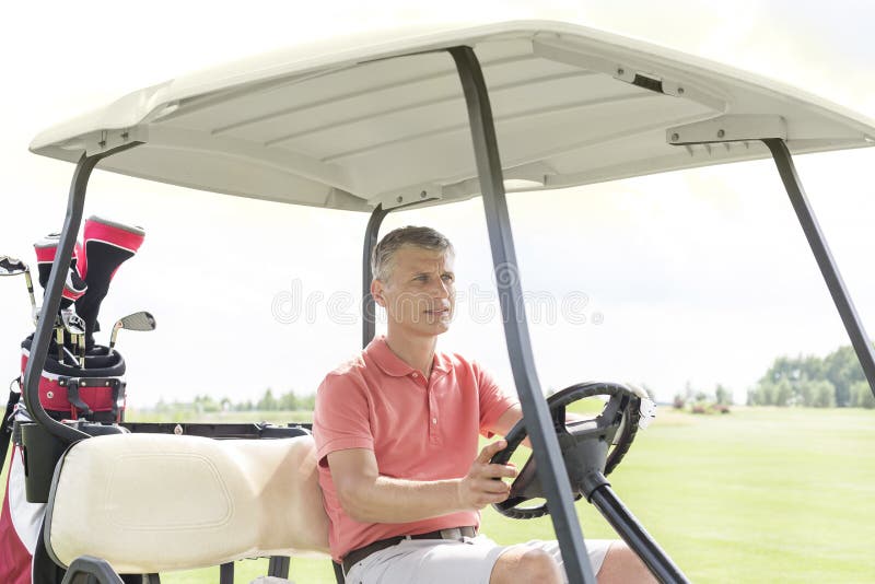 Middle-aged Man Driving Cart at Golf Course Stock Photo - Image of ...