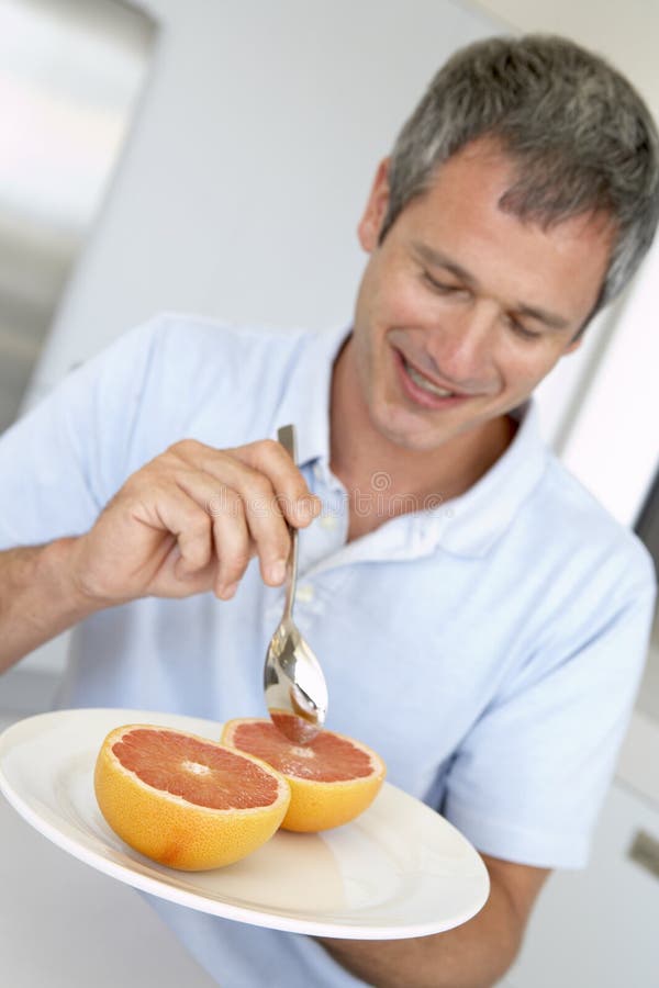Father And Son Making Fresh Vegetable Juice Stock Image - Image of ...
