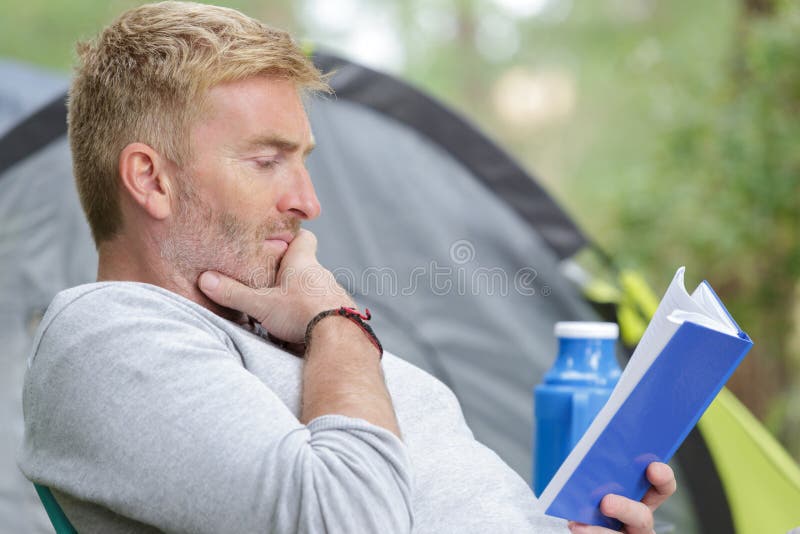 Engrossed in the Book stock photo. Image of handsome, expressive - 5092352