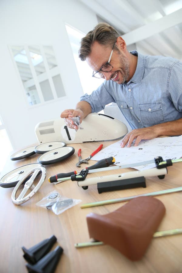 Middle Aged Man Enjoying Assembling a Toy Car Stock Photo - Image of ...