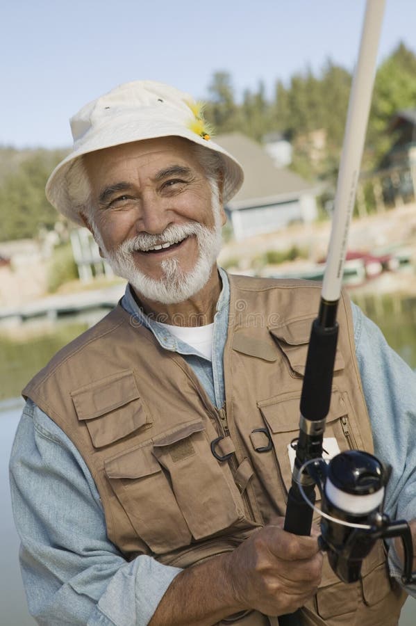 Middle-aged man fishing stock image. Image of smiling - 13584743