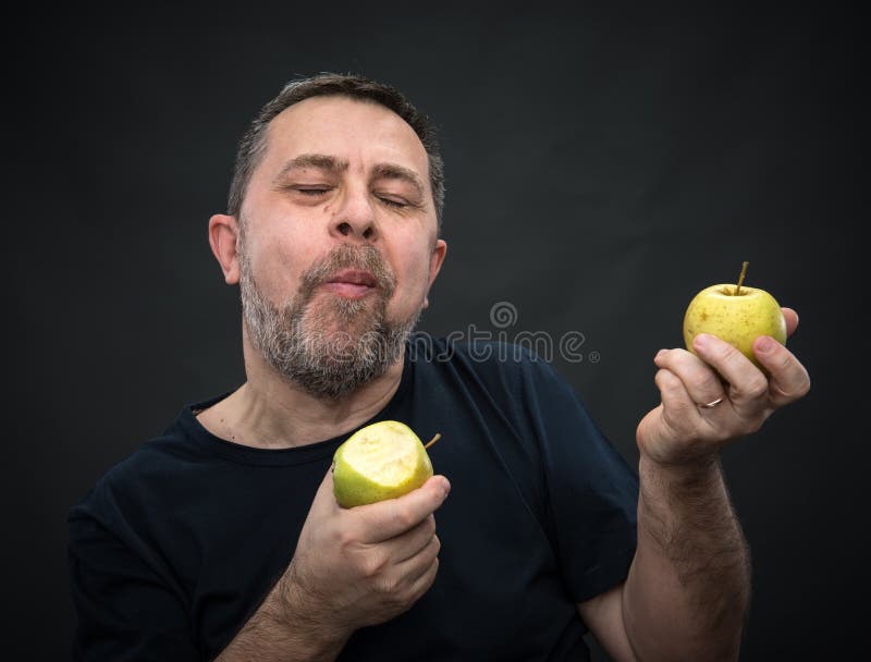 Middle-aged Man with a Green Apples Stock Photo - Image of care, fresh ...