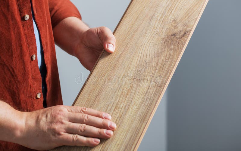 Middle-aged Man Holding a Laminate Board in His Hands Stock Photo ...