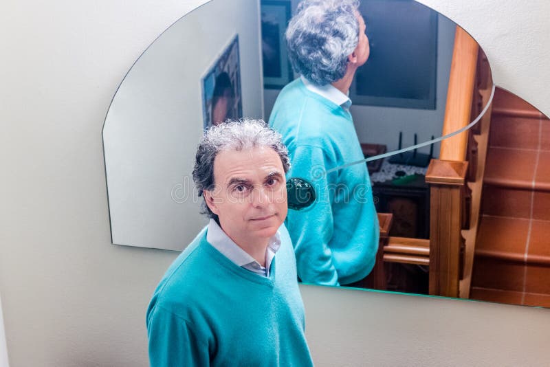 Middle-aged Man at Home in Front of Mirror Stock Photo - Image of shirt ...