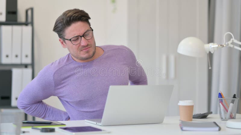 Middle Aged Man with Laptop Having Back Pain in Office Stock Image ...