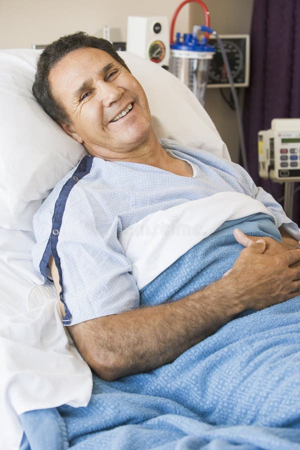 Middle Aged Man Lying in Hospital Bed Stock Photo - Image of indoors ...