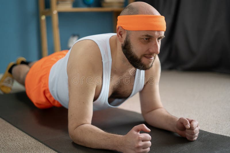 Middle Aged Man Makes an Exercise Plank. Healthy Lifestyle Concept ... Middle Aged Man Makes an Exercise Plank. Healthy Lifestyle Concept ...