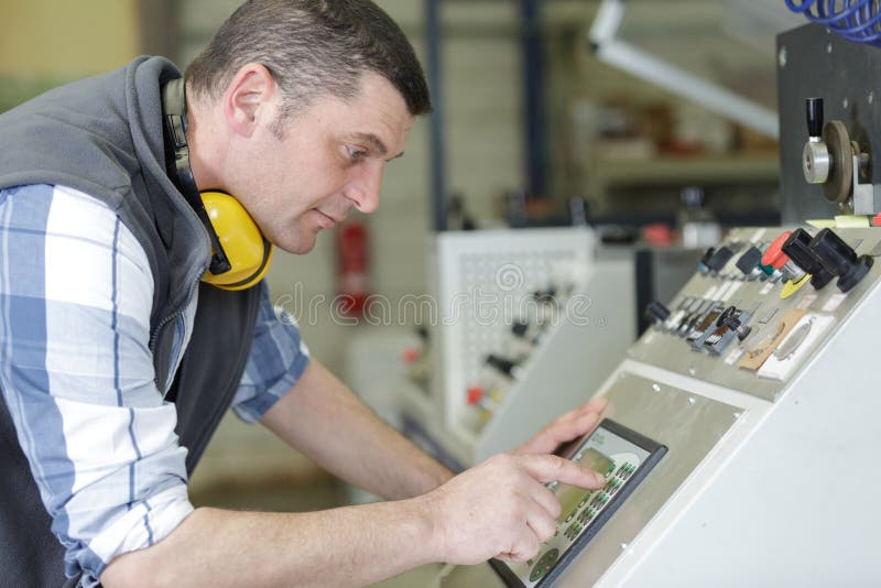 Middle Aged Man Operating Machine Stock Image - Image of machinist ...