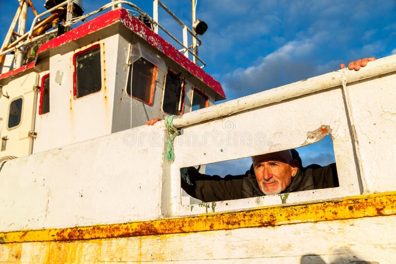 Middle-aged Man Playing Captain on a Boat Stranded on an Icelandic ...