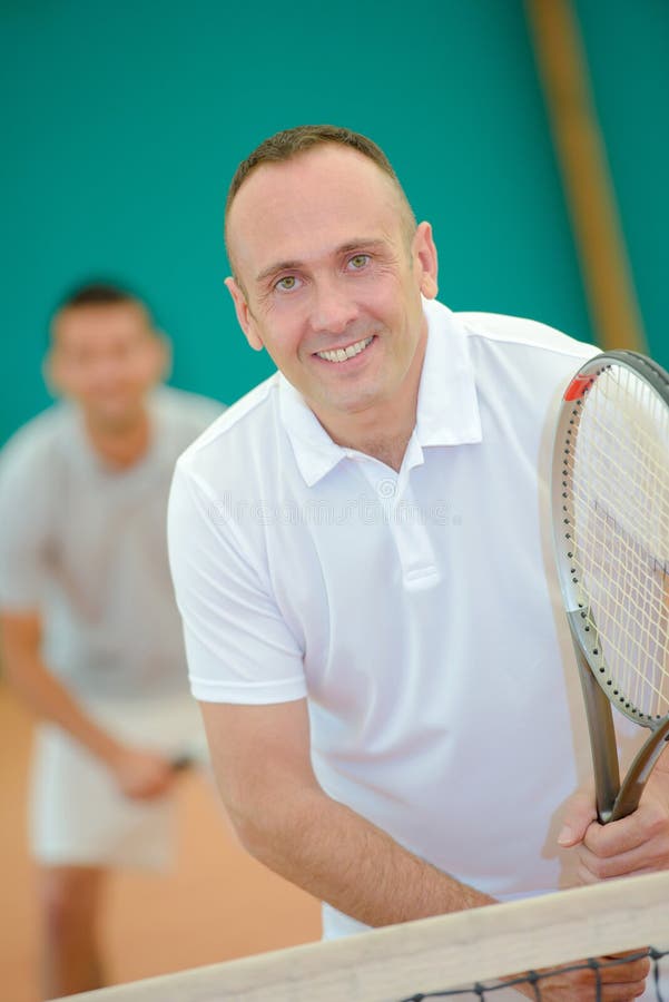 Middle-aged Man Playing Tennis Stock Photo - Image of aged, leisure ...