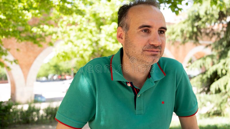 Middle-aged Man Puffing in a Park Stock Photo - Image of green, nature ...