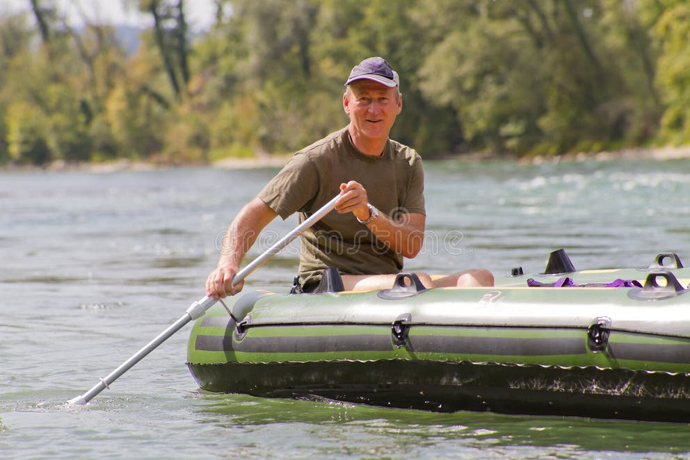 Middle aged man rafting stock image. Image of raft, lake - 21404779