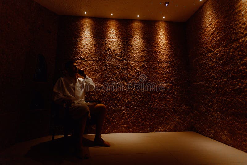 Middle Aged Man Relaxing in a Salt Room in the Spa. Getting the ...