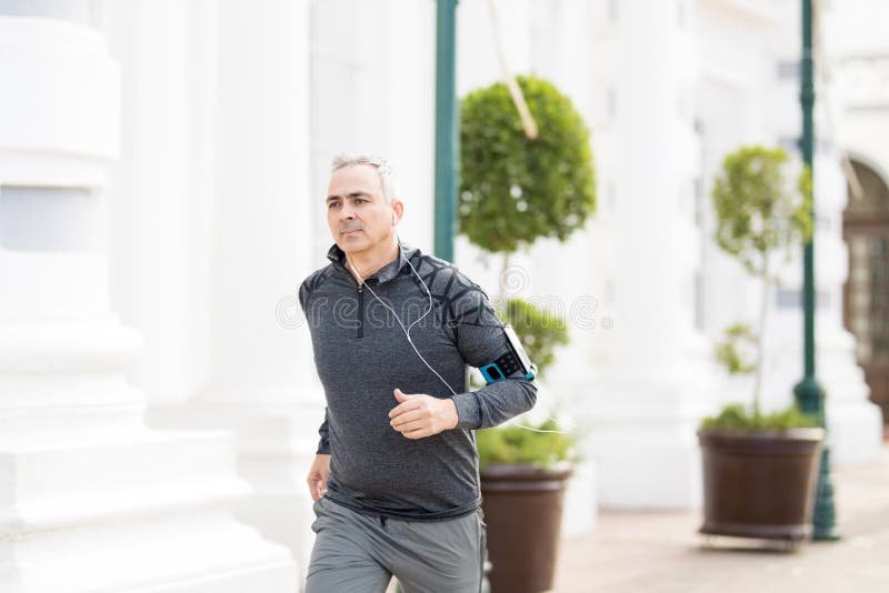 Middle Aged Man Running in the City Stock Photo - Image of copy, people ...