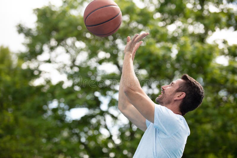 Middle Aged Man Shooting Free Throws Stock Photo - Image of park, shoot ...