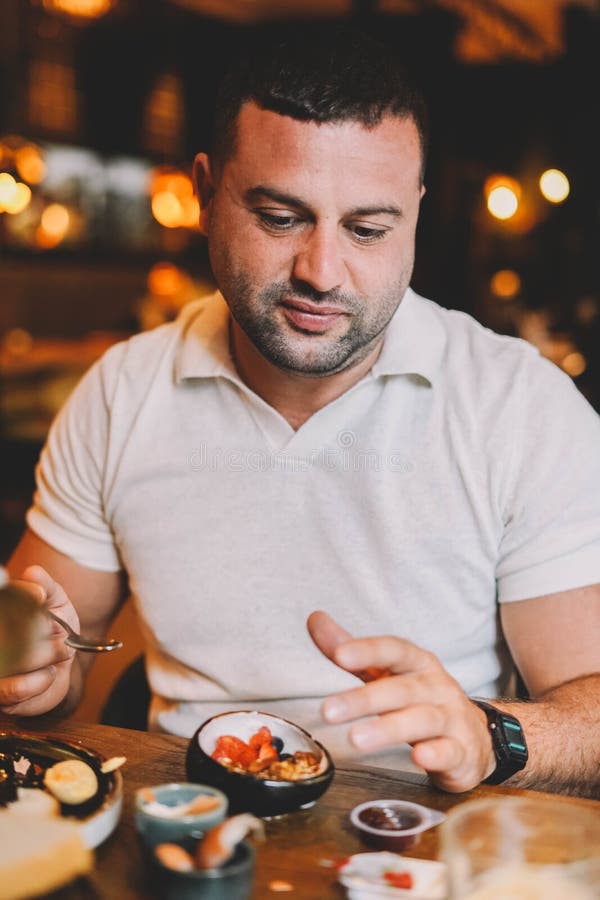 Middle Aged Man Sitting in a Bar Having Breakfast Stock Image - Image ...