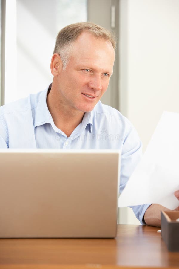 Middle Aged Man Using Laptop at Home Stock Image - Image of person ...