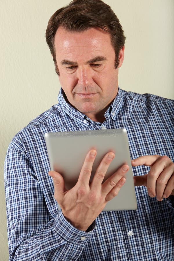Middle Aged Man Using Tablet Computer Stock Image - Image of screen ...