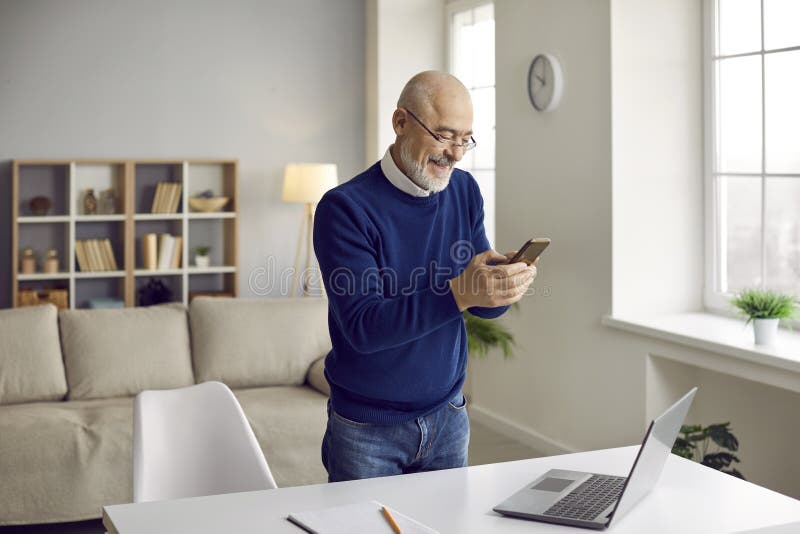Middle-aged Man Work on Laptop Use Smartphone Stock Photo - Image of ...