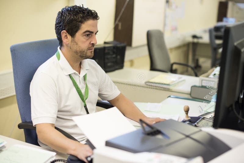 Middle-aged Man Working at His Office Using Computer. Stock Image ...