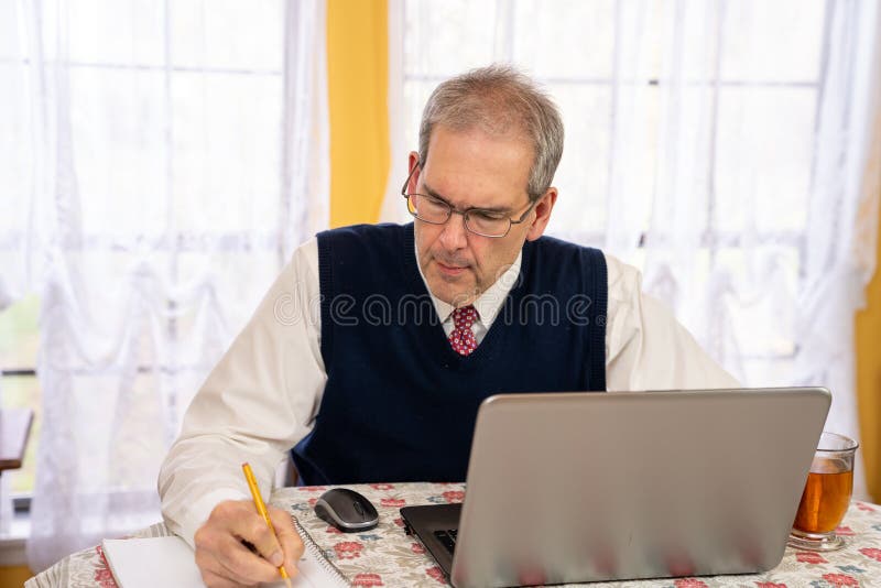 Middle Aged Man Working from Home in Dining Room Stock Photo - Image of ...