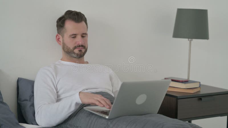 Man Working on Laptop in Bed Stock Video - Video of adult, typing ...