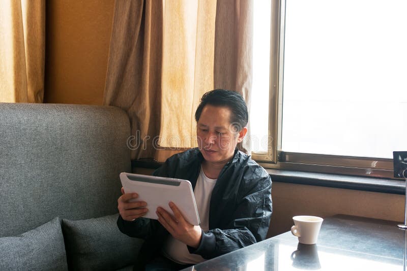 Middle-aged men Tablet PC stock photo. Image of technology - 39325548