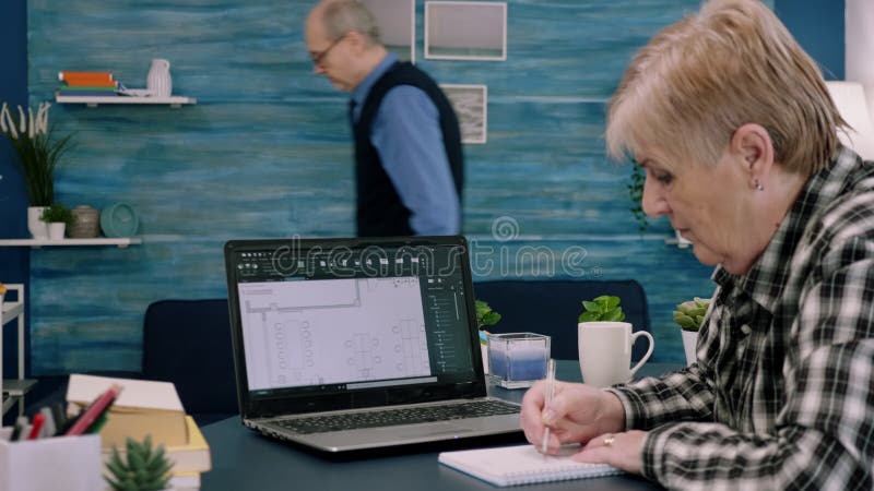 Middle Aged Woman Engineer Working with Architectural Plans Stock Video ...