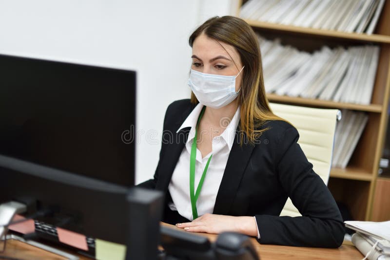 Middle Aged Woman Office Manager in Protective Mask Using Computer in ...
