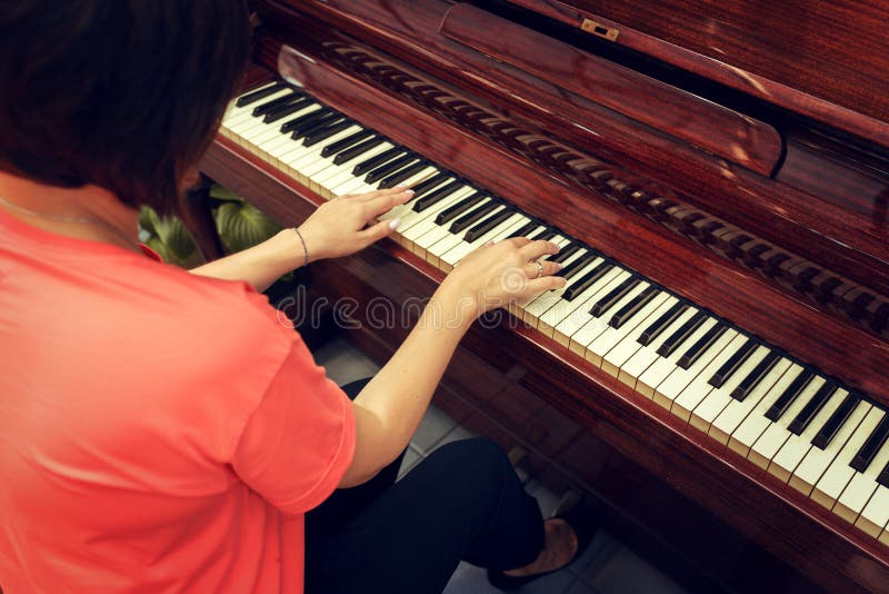 Middle Aged Woman Playing Piano Back View Stock Photo - Image of ...