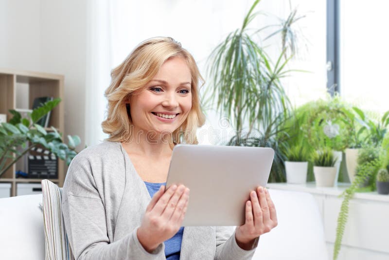 Middle Aged Woman with Tablet Computer at Home Stock Photo - Image of ...