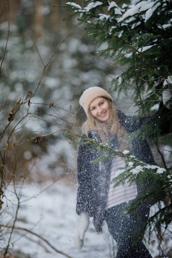 Middle-aged Woman Under the Christmas Tree in the Woods before ...