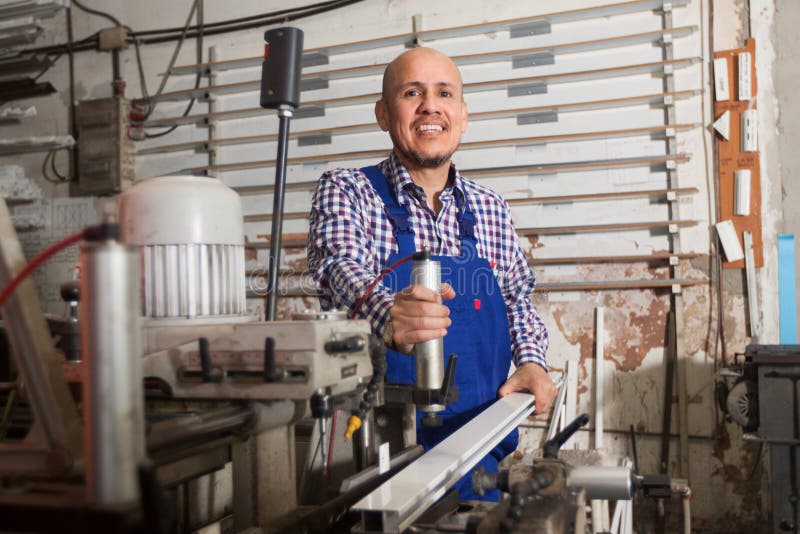 Middle-aged Worker Working for the Lathe in the Factory Stock Photo ...