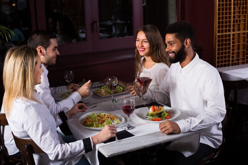 Middle Class People Enjoying Food in Cafe and Talking Stock Image ...