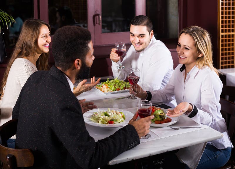 Middle Class People Enjoying Food in Cafe and Talking Stock Image ...