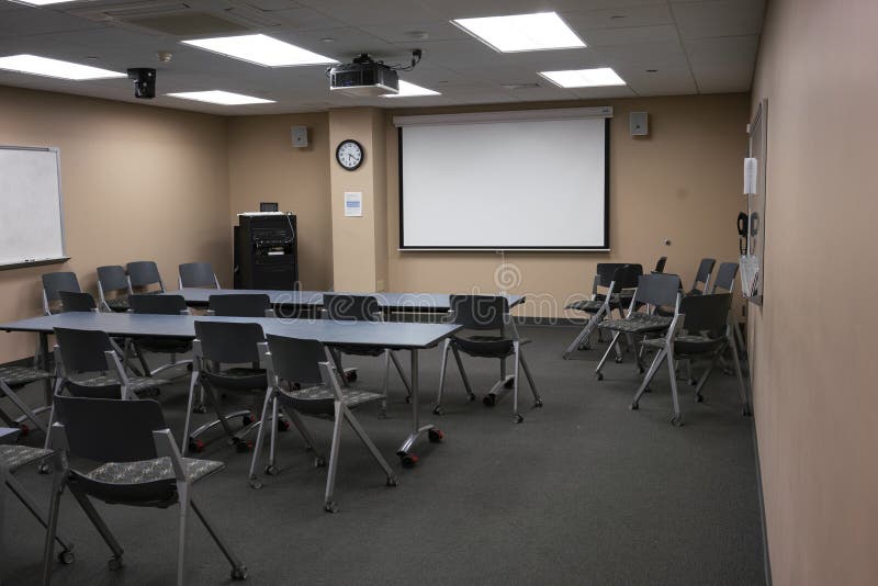 An Empty College Classroom with a Blank Smart Board Stock Image - Image ...