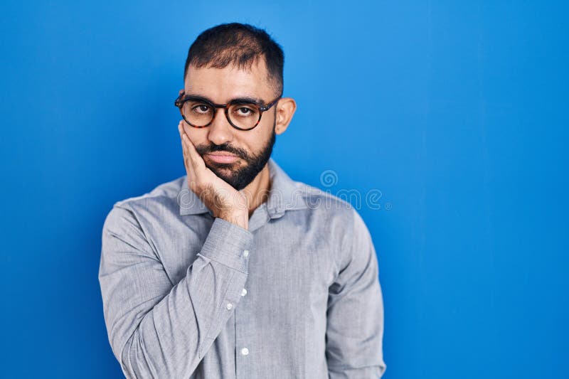 Middle East Man with Beard Standing Over Blue Background Thinking ...