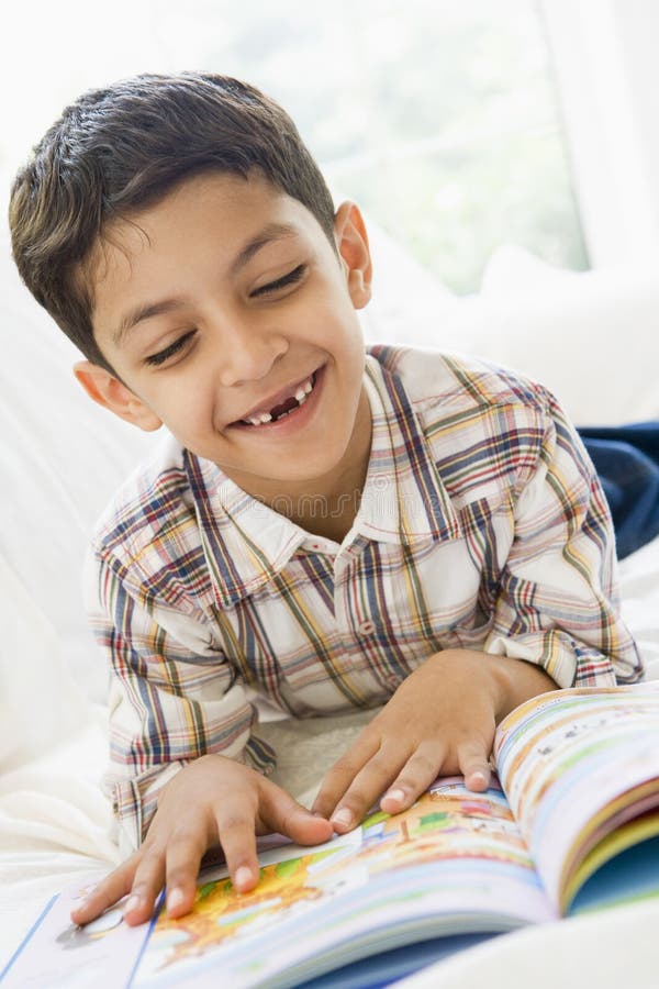 Middle Eastern boy reading stock photo. Image of middle - 6079596