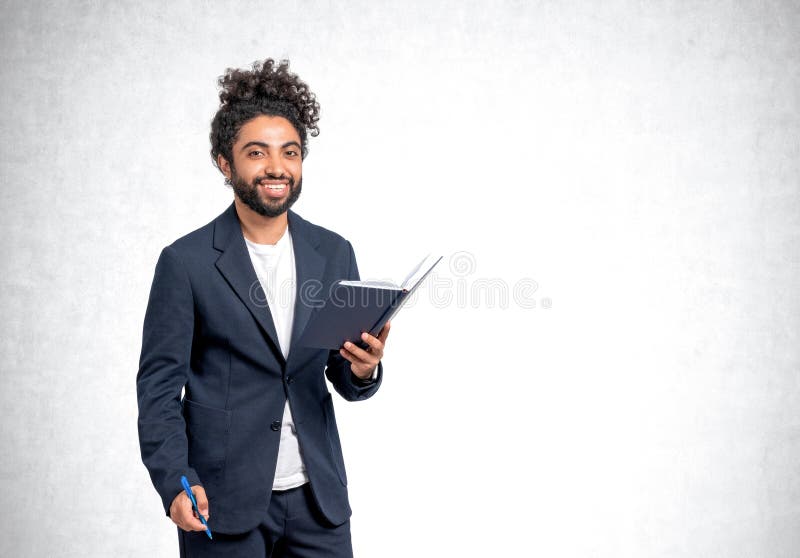 Middle Eastern Businessman with Notebook and Pen Smiling, Copy S Stock ...