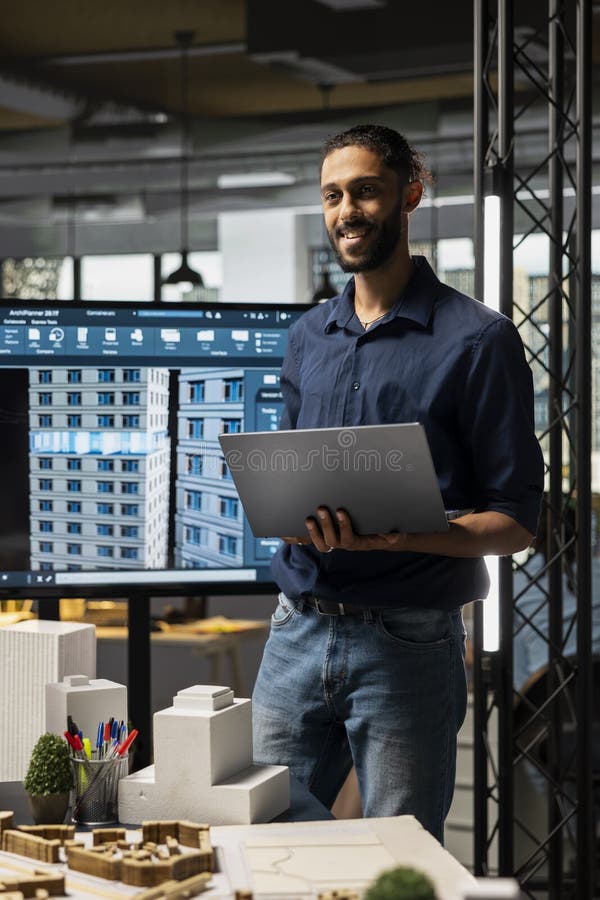 Middle Eastern Engineer Finalizing Plans for Land Acquisition in a ...