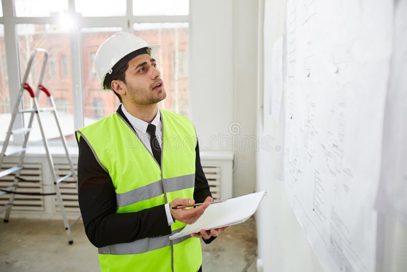 Middle-Eastern Engineer Inspecting Site Stock Photo - Image of holding ...