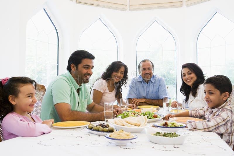 A Middle Eastern Family Enjoying a Meal Together Stock Image - Image of ...