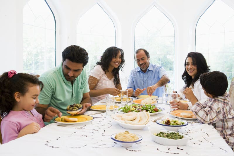 A Middle Eastern Family Enjoying a Meal Together Stock Photo - Image of ...