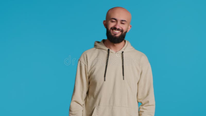 Middle Eastern Guy Greeting People in Front of Camera Stock Video ...