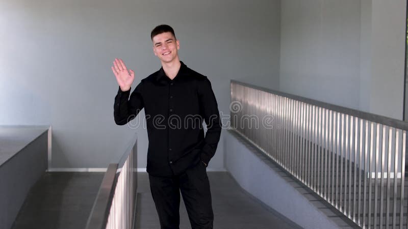 Middle Eastern Guy Greeting People in Front of Camera, Waving Hello and ...