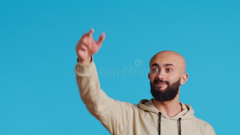 Middle Eastern Guy Welcoming People in Studio with a Wave Stock Video ...